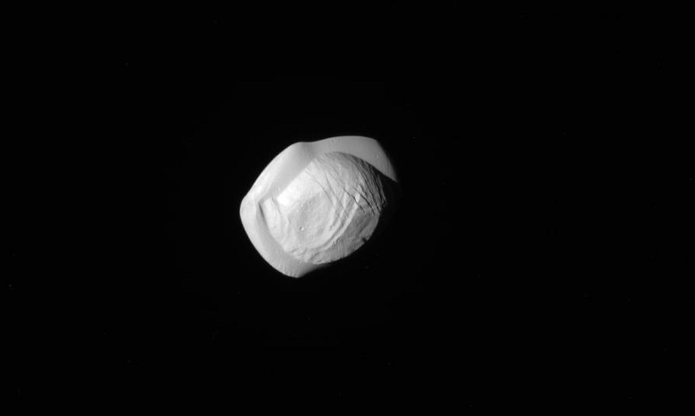 Cassini images show strange shape of Saturn's moon Pan - Redorbit